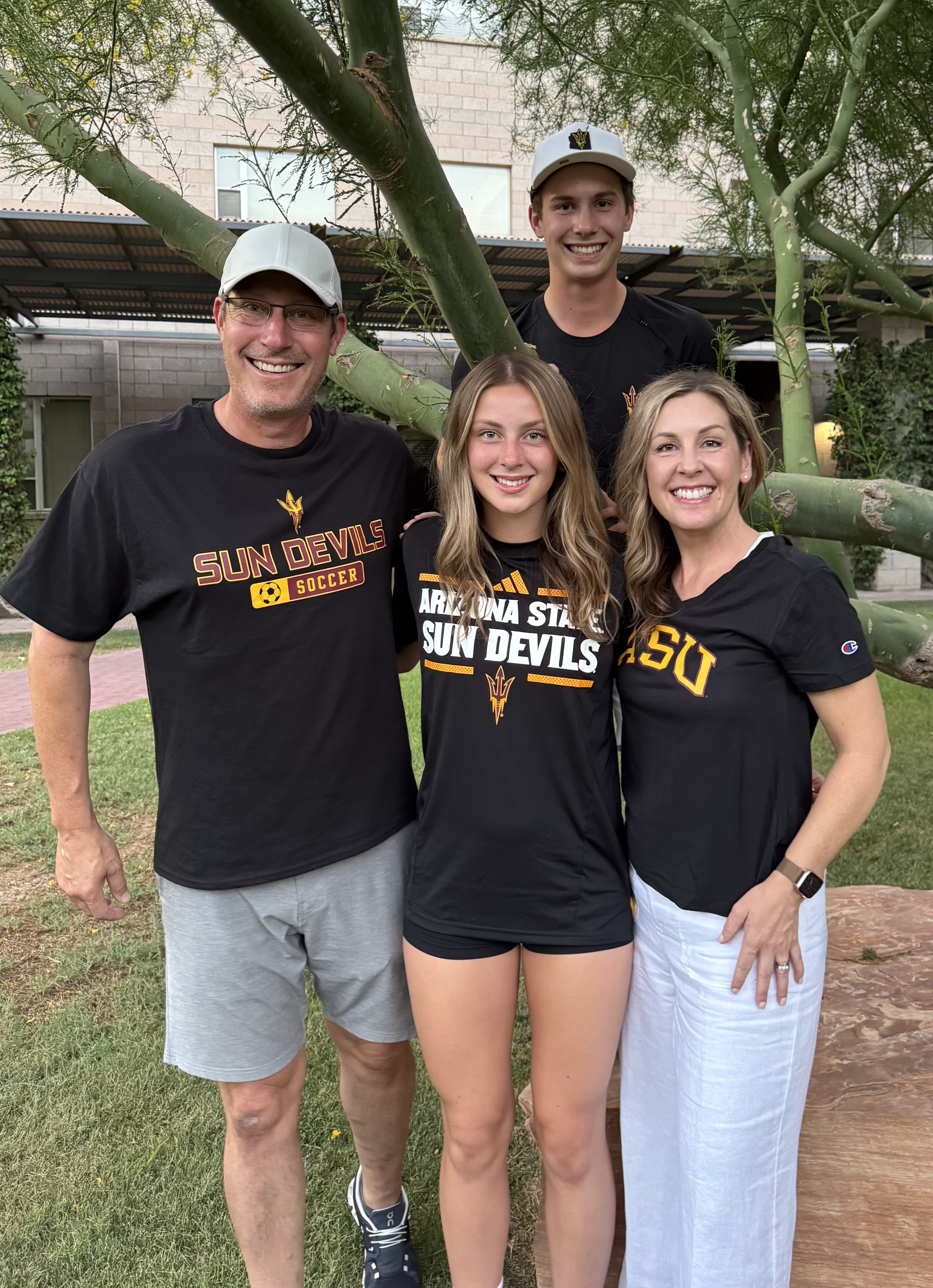 Proud parents watch their daughter step into the | The ASU Family Hub